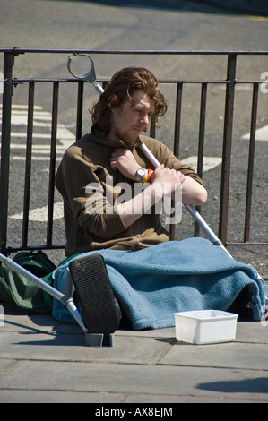 Candid picture of a man begging on a street in Edinburgh, Scotland ...