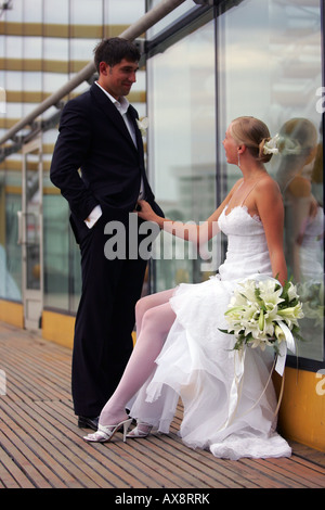 Newlywed couple happy together at white decorated room Stock Photo - Alamy