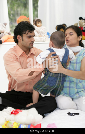 Parent pacifying a crying baby Stock Photo - Alamy
