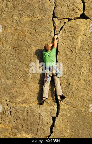 A climber on a limestone cliff face Stock Photo - Alamy
