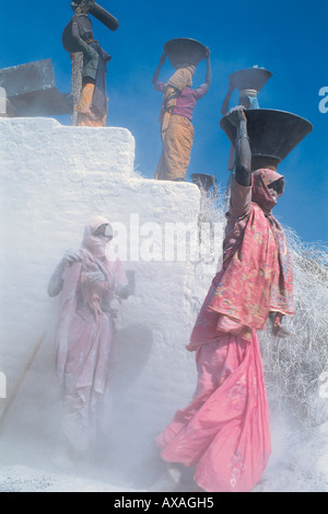 Group of women carrying heavy loads of firewood in the Nepal Himalayas ...