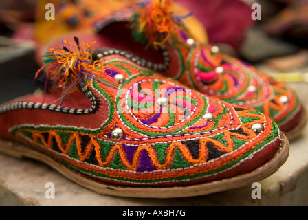 Traditional colourful shoes produced by the Ben Yedder shoe workshop ...