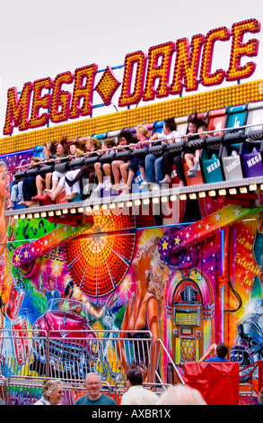 Teenagers on MEGA DANCE fair ride during Newent Onion Fayre Newent ...