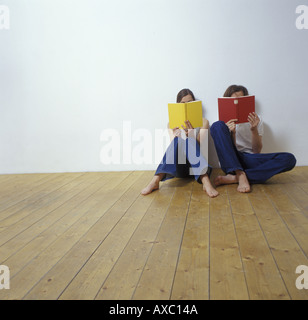 Concentrated student girl reading books Stock Photo - Alamy