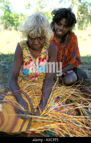 Aboriginal woman weaving a traditional pandanus mat in Arnhem Land ...