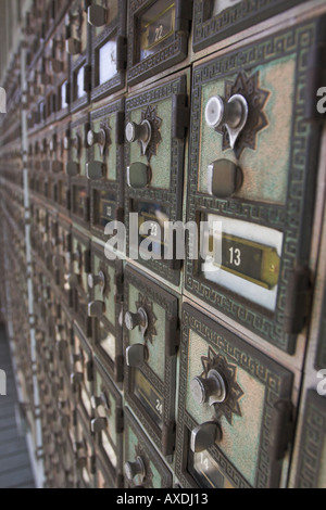Rows and columns of post office mail boxes with numbers and locks Stock ...