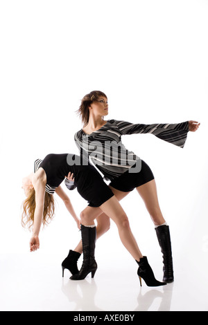 Two women enjoying a dance move outdoors Stock Photo - Alamy