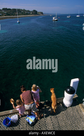 Two people fishing from a jetty at Lake Dunstan, Cromwell, Central ...