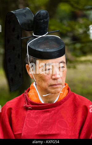 A man dressed in Heian period costume at the Gokusui no en festival in ...