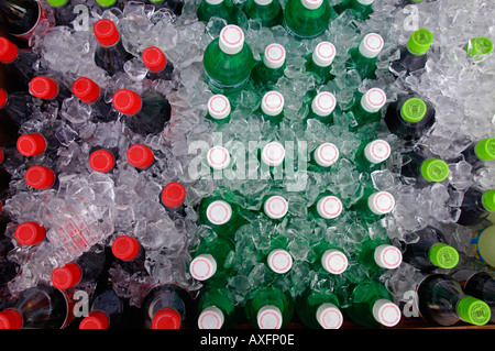 bottles with soft drinks in ice cubes Stock Photo - Alamy