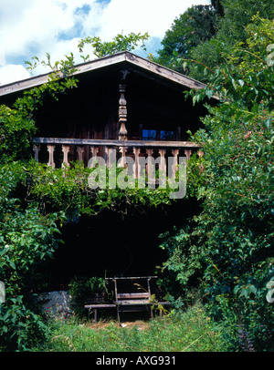 A Bavarian farm house balcony with farming equipment displayed Bavaria ...
