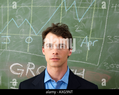 Businessman making a line graph Stock Photo - Alamy
