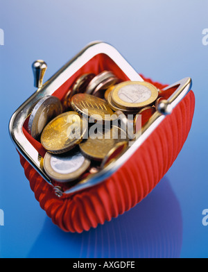 Purse full of money Stock Photo - Alamy