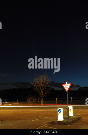 sign signal drive night nighttime track signpost straight ahead follow ...