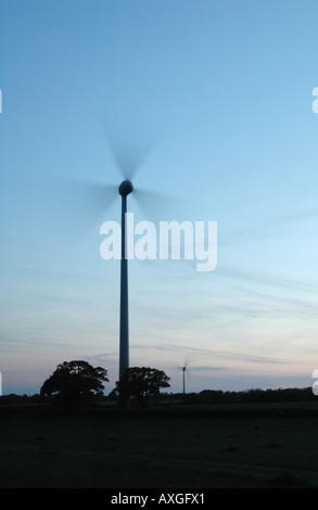 Landscape at dusk of wind turbines with movement at Swaffham in Norfolk ...