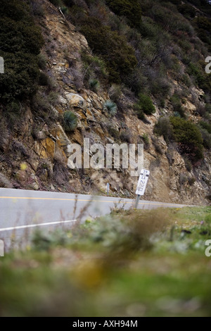 Mile marker sign along mountain road Stock Photo - Alamy