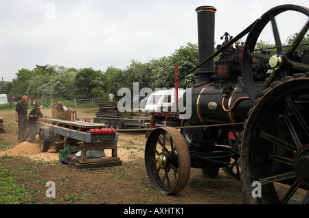 Circular saw, powered by a steam traction engine, cutting wood at ...