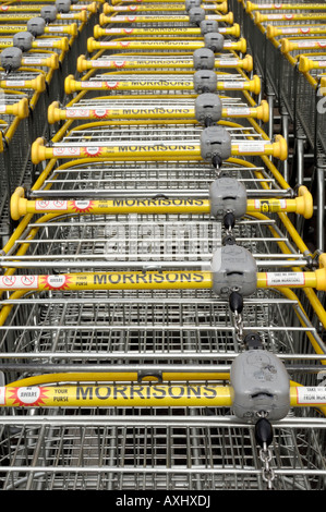 Morrisons supermarket shopping trolleys parked in trolley bay Stock ...