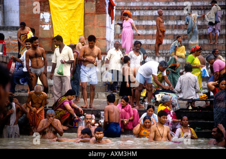 Hindu pilgrims gathering at a ghat to bathe in the Ganges river in ...