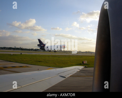Jet plane taking off in cloudy sky, panoramic shot Stock Photo - Alamy