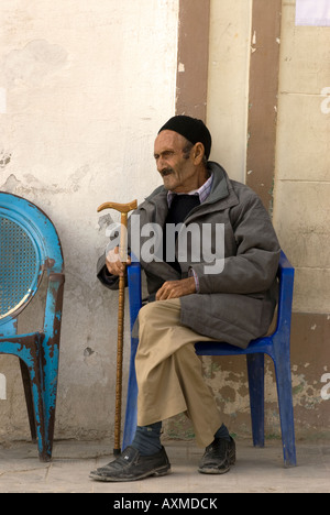 Libyan men sitting outside cafe near Arch of Marcus Aurelius, Tripoli ...