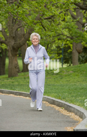 Senior woman jogging on a Spring morning in Brighton, East Sussex ...