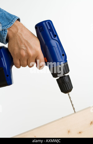 construction worker using a cordless drill to construct a drywall Stock ...