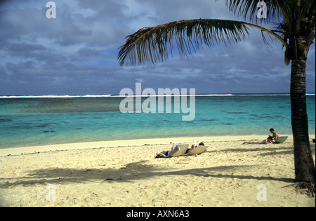 Sunbathing tourists on a wonderful beach in the South Pacific Stock ...