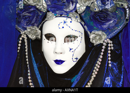 Carnival mask with beads on blue background Stock Photo - Alamy