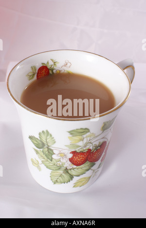Cup of tea, teapot and tea bags on wooden table close-up Stock Photo ...