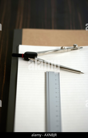 A vertical high angle shot fo fallen red orange autumn leaves in a ...