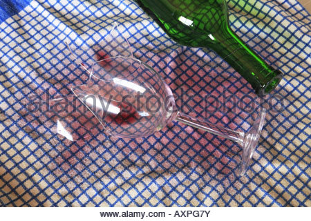 Broken bottle of spilt red wine on supermarket floor Stock Photo ...