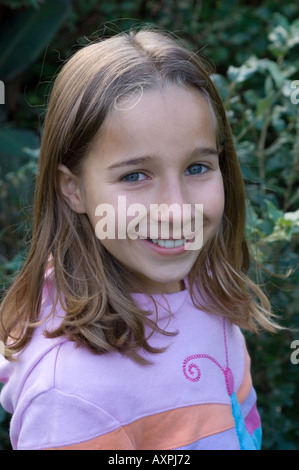 young girl smiling cheekily Stock Photo - Alamy