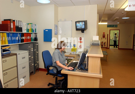 A receptionist in a NHS (National Health Service) East Quay Medical ...