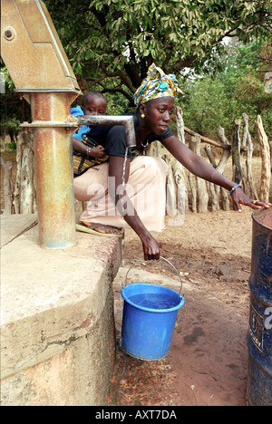 A Woman on her way to collect water from small water pond. Thar desert ...