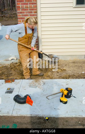Female worker doing landscaping work Stock Photo - Alamy