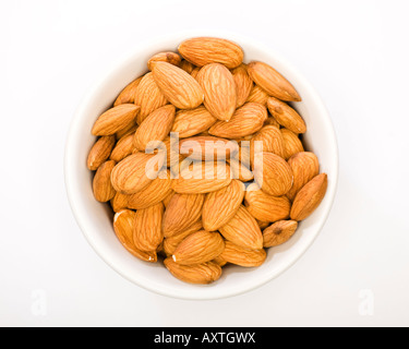 Almonds nuts heap in the bowl Stock Photo - Alamy