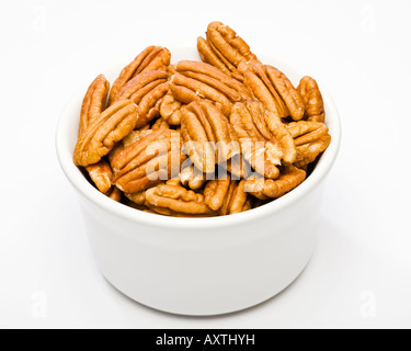 Studio shot of pecans on white background. Heap of pecans in nutshell ...