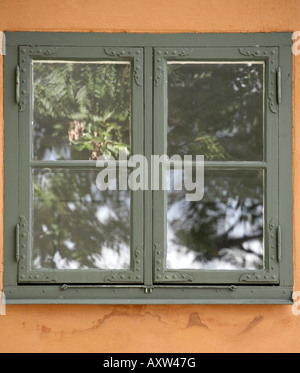 A Four pane window frame with a window box of red Tulips Stock Photo ...