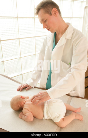 baby portrait and pediatrician check Stock Photo - Alamy