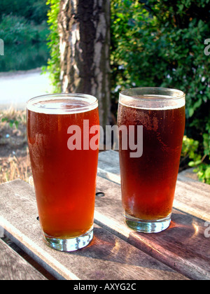 Two pints of beer in a pub beer garden Stock Photo - Alamy