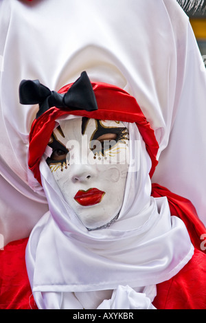 carnival white mask on red background Stock Photo - Alamy