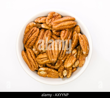Studio shot of pecans on white background. Heap of pecans in nutshell ...