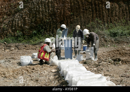 Grade control sampling in surface gold mine opencast pit with geologist ...