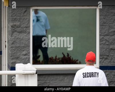 window reflection of a security guard in the Museum of Modern Art in ...