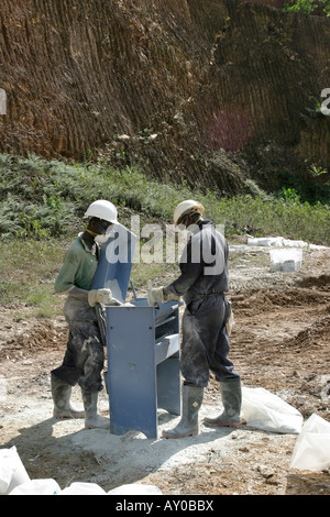 Grade control sampling in surface gold mine opencast pit with geologist ...