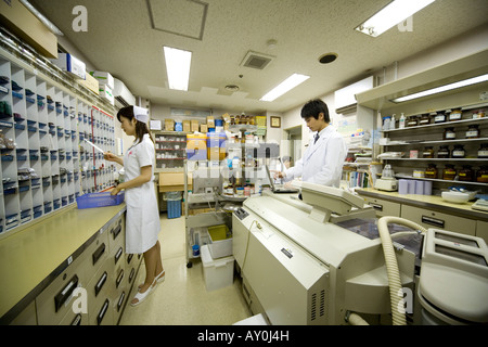 nurse and pharmacists working in pharmacy Stock Photo - Alamy