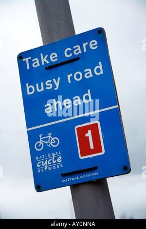 Cycle route ahead warning sign with a blue sky Stock Photo - Alamy