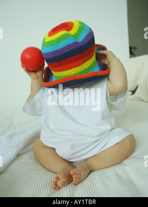 Cute baby girl with a colored face Stock Photo - Alamy