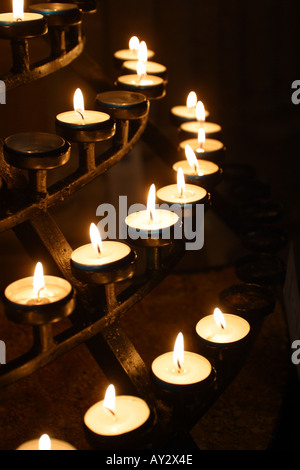 many lit candles in dark room in church Stock Photo - Alamy